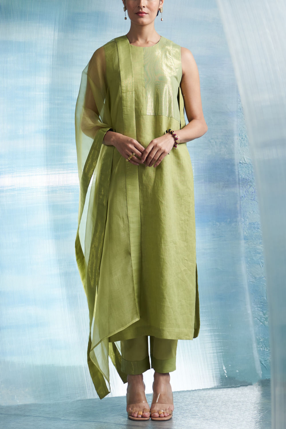 Buy Sheen green shimmery sleeveless kurta set by Charkhee at Aashni and Co